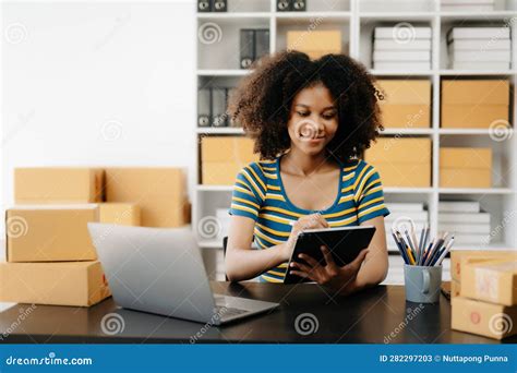 Small Business Entrepreneur Sme Freelance African Woman Working At Home Office Box Tablet And