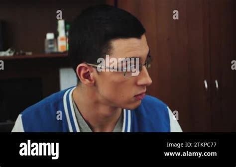 Boy Sit On Chair At Table Look Left Muscle Man Come From Right And