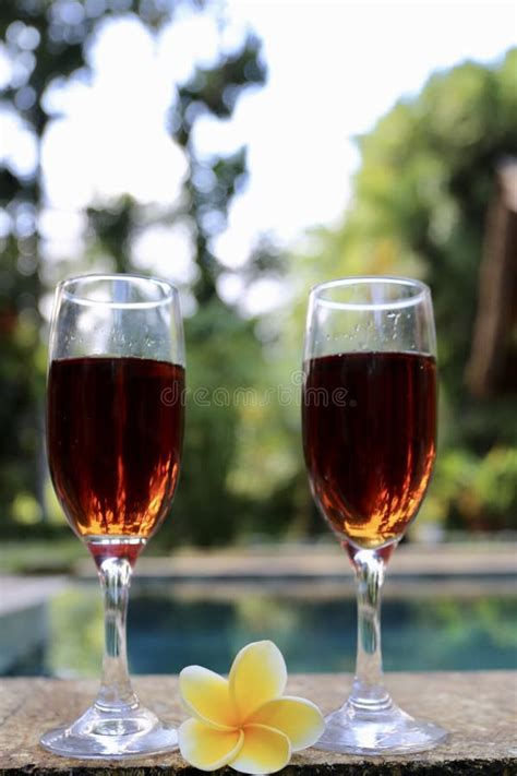 Glasses With Red Wine Near The Swimming Pool In The Tropics Stock Image