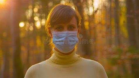 Portrait Golden Sunset Shines On Woman Exploring The Forest With A