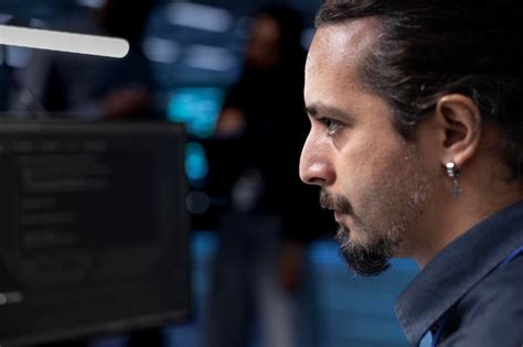 Premium Photo Engineer In Server Farm Checking Recovery Plan Monitoring Data Center