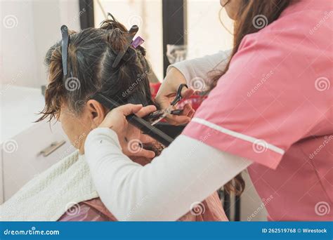 Adult Woman Getting A Haircut In A Specialized Beauty And Spa Center
