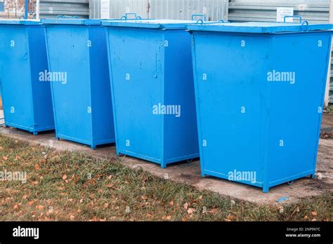 Type Of Garbage Cans Metal Dumpsters Stand In Row On Special Site