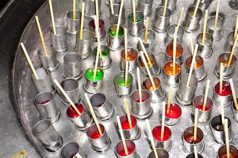 Premium Photo Colorful Soft Drinks In Swirling Tubes In Water With
