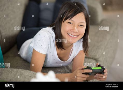 Woman Using Joystick While Playing Video Games Stock Photo Alamy