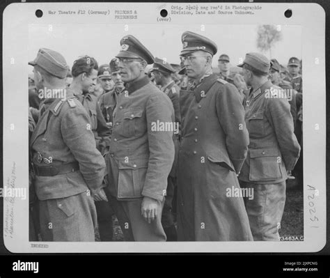 Captured German Officers Standing In Line Waiting For C Rations At The Prisoner Of War Camp