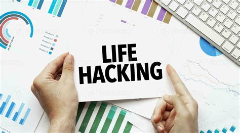businessman holding a card with text life hacking keyboard diagram