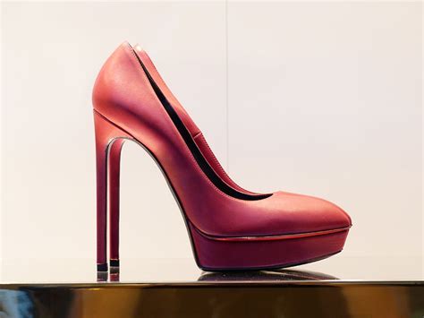 Royalty Free Photo Pair Of Red Leather Platform Stilettos On Brown