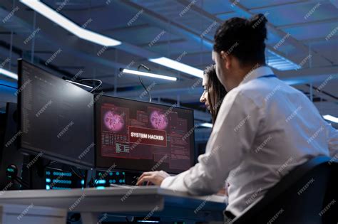 Premium Photo It Staff Members In High Tech Facility Trying To Protect Servers From Hacker