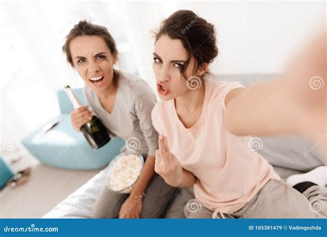 girls are crying at the hen party they are sitting on the bed in room