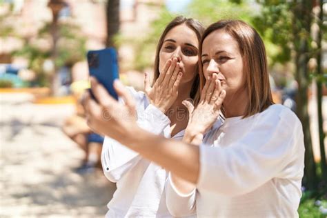 Two Women Mother And Graduated Daughter Having Video Call At Campus