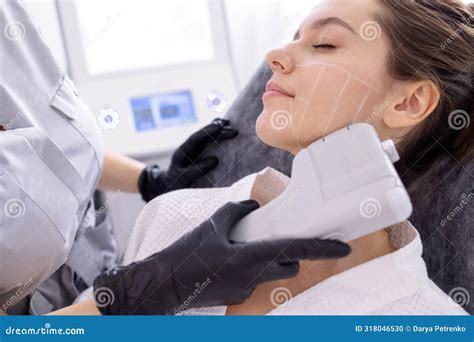 Portrait Of Relaxed Young Female Client Getting Smas Ultrasound Face