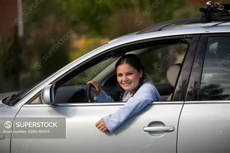 Teen Girl Driving Car Superstock