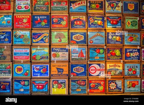 A Stack Of Wooden Crates Each Adorned With Colorful Labels