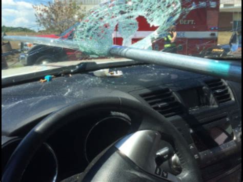 Fence Pole Crashes Through Car Windshield In Woburn Driver