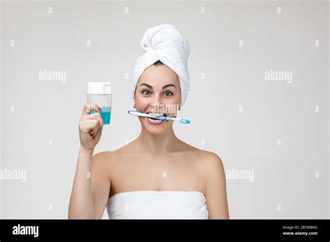 Happy Young Woman In Towel Brush Her Teeth In The Morning Girl Holding