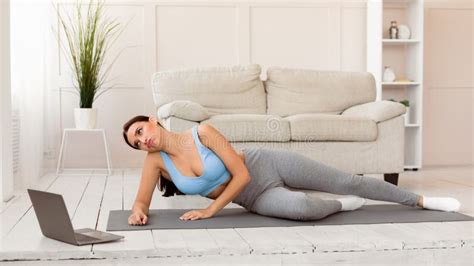 Woman Training Watching Online Workout Video Training At Home Panorama