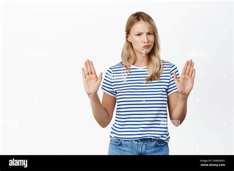 Portrait Of Woman Showing Stop Sign Raising Hands Up Prohibit Action