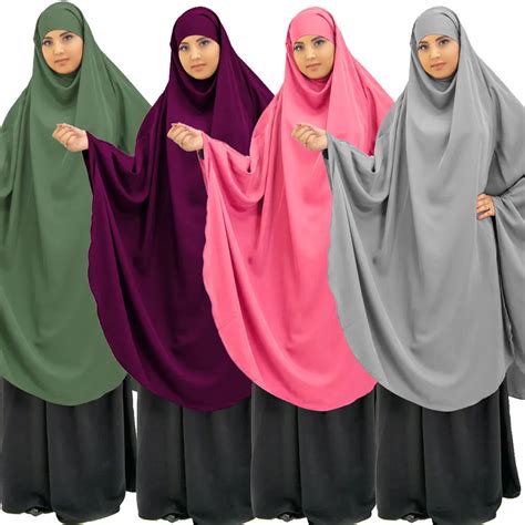 Muslim Woman In Hijab Praying