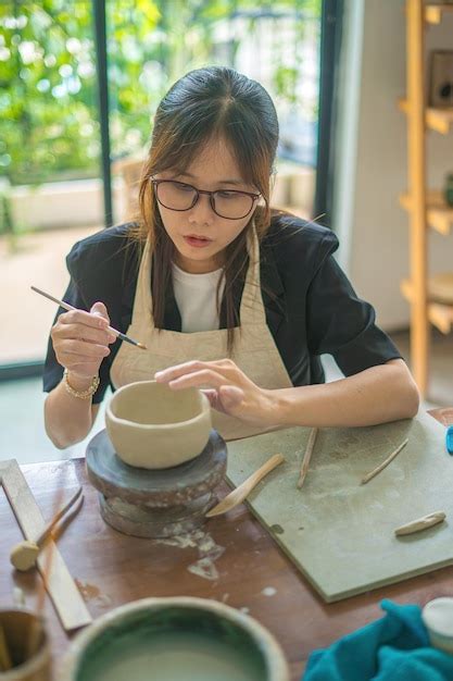 Premium Photo Beautiful Woman Potter Working On Potters Wheel Making