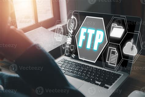 Ftp File Transfer Protocol Person Using Laptop Computer On Desk With File Transfer Protocol