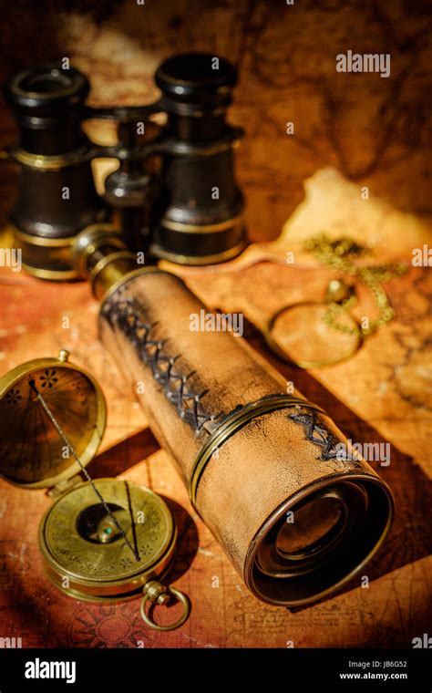 Old Vintage Retro Compass And Spyglass On Ancient World Map Vintage