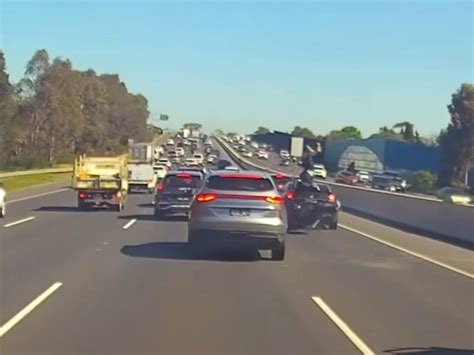 Incredible Moment Motorcyclist Flips On Top Of Car After Crashing Into