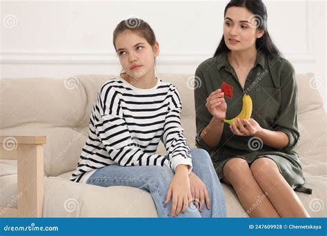 Mother Talking With Her Teenage Daughter About Contraception At Home