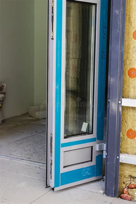 Installation Of A Glass Entrance Door In A Building Under Construction