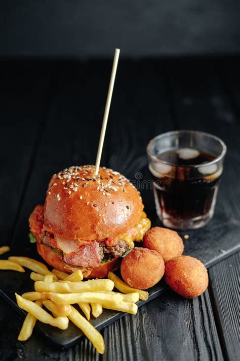 Homemade Juicy Burger On Wooden Board Cheese Balls With French Fries