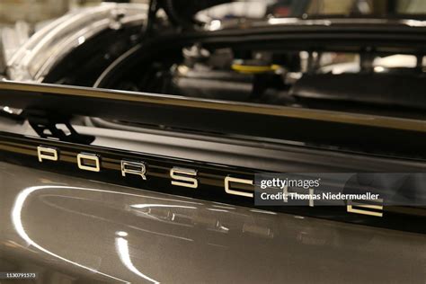 Workers Assemble Porsche Cars On An Assembly Line At The Porsche