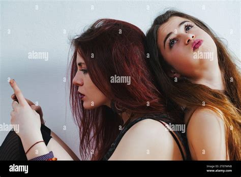 Two Females Navigate The Paradox Of Being Connected Digitally But