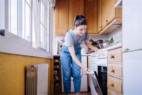 Woman Cooking At Home By Stocksy Contributor Luis Velasco Home