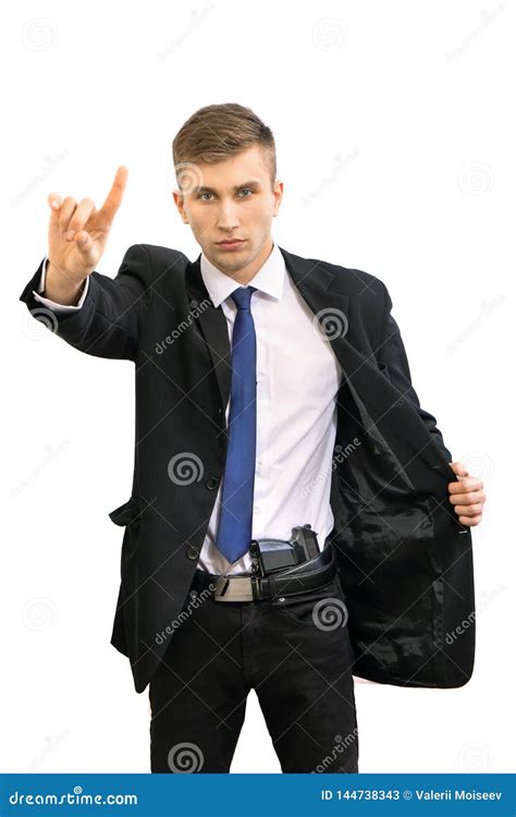 Portrait Of Young Attractive Serious Security Business Man With Gun In