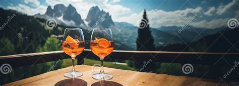 Two Glasses Of An Aperol Spritz Cocktail Against The Backdrop Of Snow