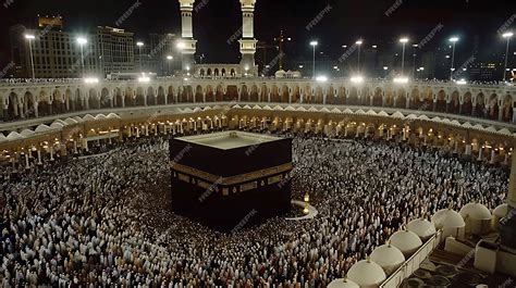 Premium Photo A Large Crowd Of People Gathers Around A Black Cubeshaped Building In Mecca