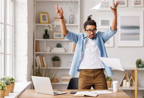 Furious Black Businessman Throwing Papers In Home Office Stock Image