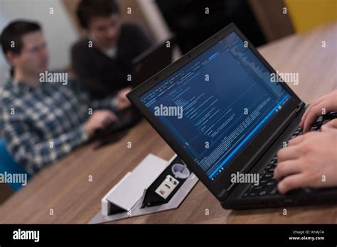 Software Developer Writing Programming Code On Laptop Computer Stock