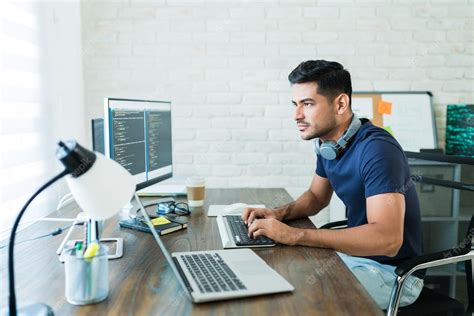 Premium Photo Handsome Young Male Programmer Coding While Typing On