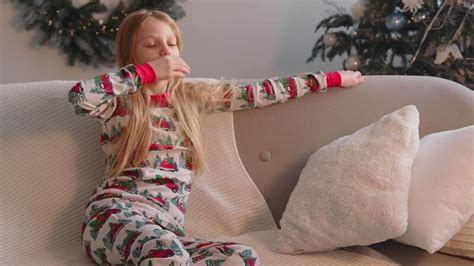 Girl Sleeping Peacefully In Christmas Pajamas Blonde Girl Resting On A