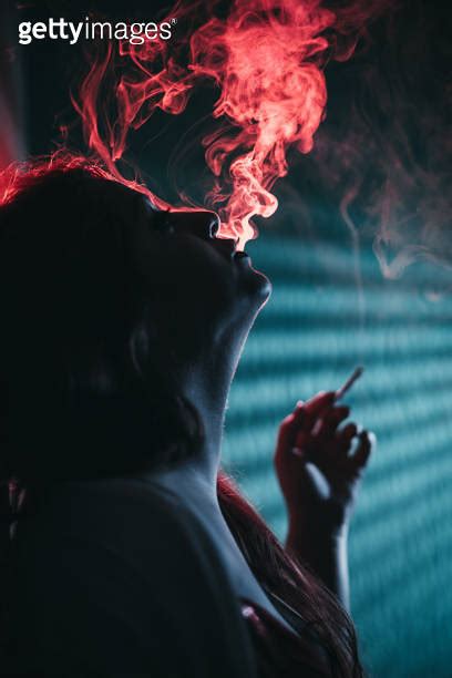 Young Seductive Woman Smoking Cigarette 이미지 1064250914 게티이미지뱅크
