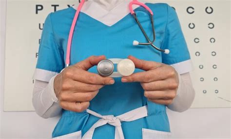 Premium Photo Ophthalmologist Holds Contact Lenses And An Eye Chart Closeup Vision Test Chart