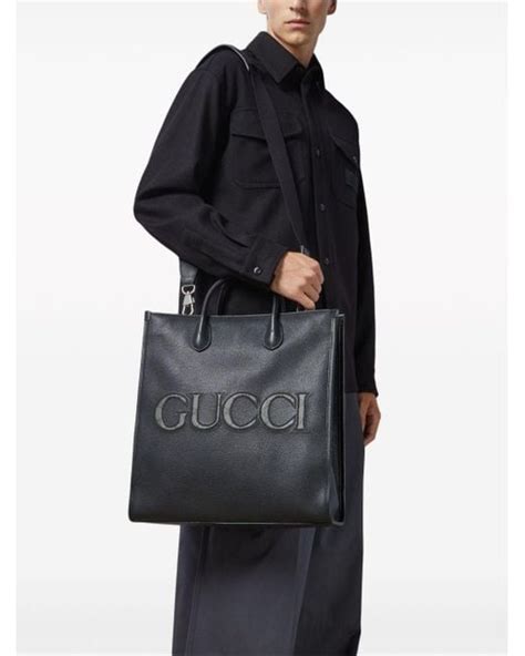 Gucci Logo Embossed Leather Tote Bag In Black For Men Lyst