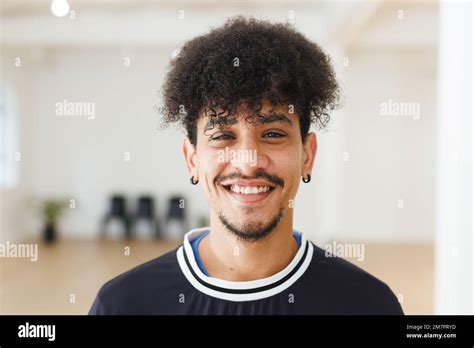 Image Of Happy Biracial Male Hip Hop Dancer Posing To Camera Stock
