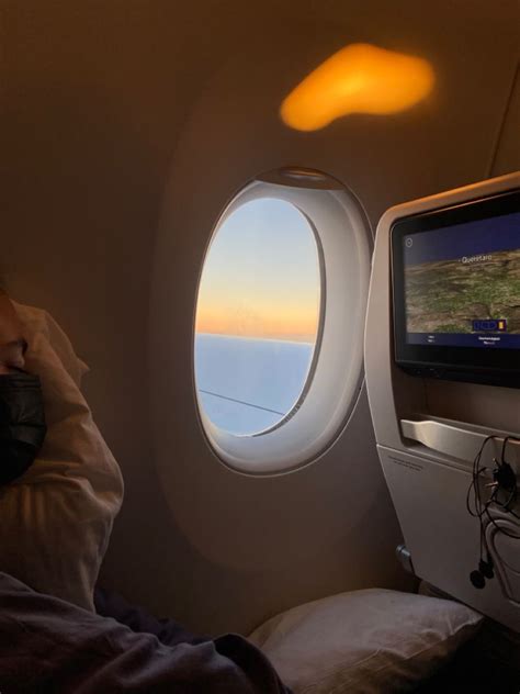 Airplane Window View Of Ocean And Land Travel Aesthetic
