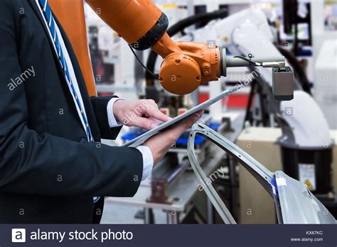 Engineer Hand Using Tablet With Machine Real Time Monitoring System