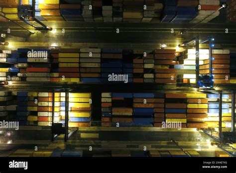 Aerial Top View Of Container Ship Loading And Unloading Process Commercial Port Evening Stock