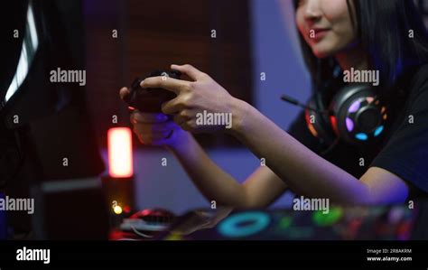 Female Cyber Hacker Gamer Using Controller Joystick To Playing Or