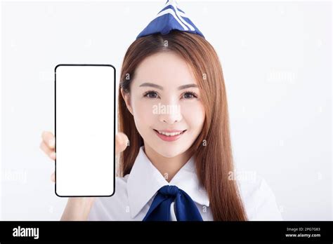 Beautiful Airline Stewardess Showing The Mobile Phone With Blank Screen