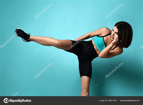 Athletic Brunette Woman Trainer Kickboxer Mma Fighter In Black